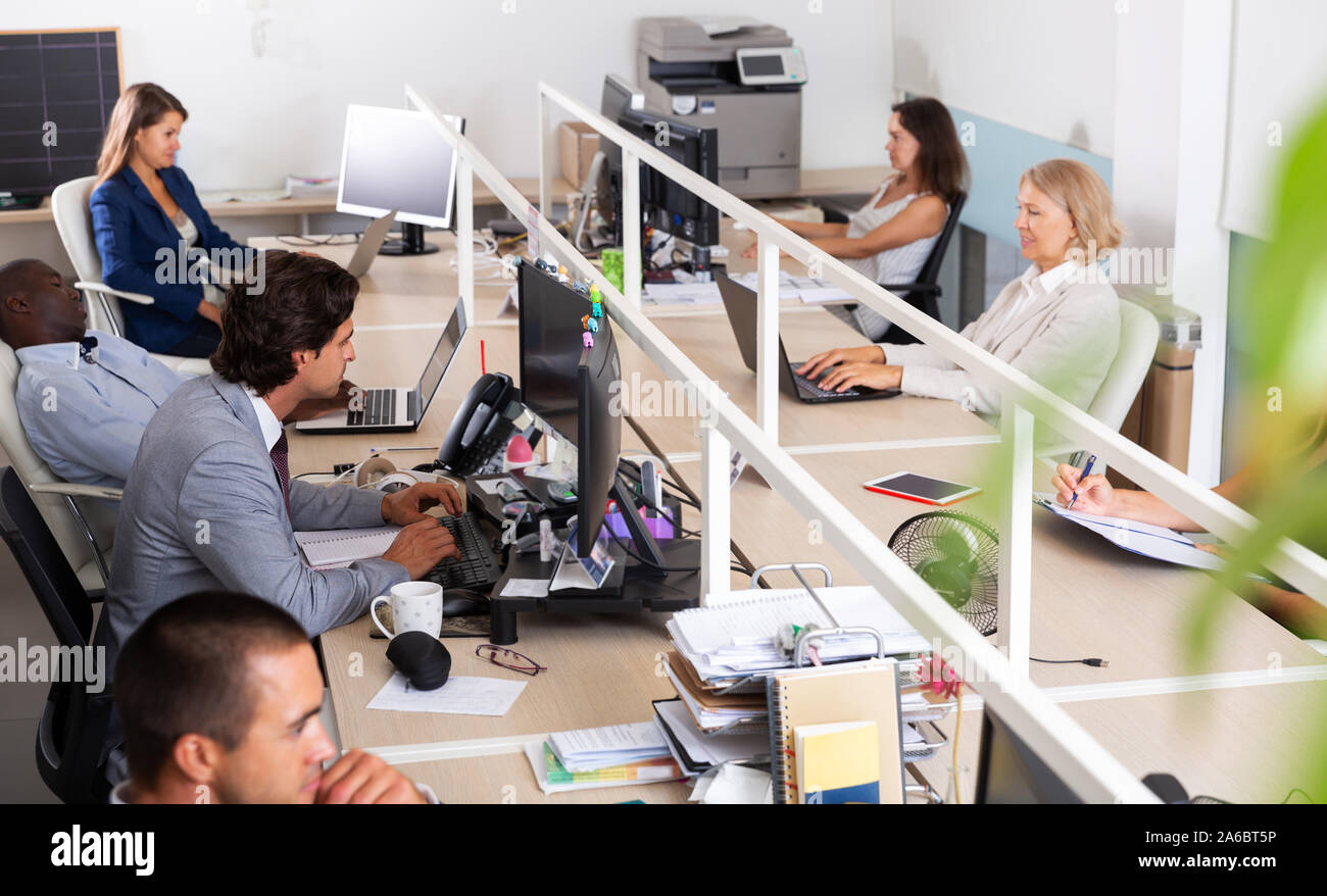 positive international business team working and communicating together ...