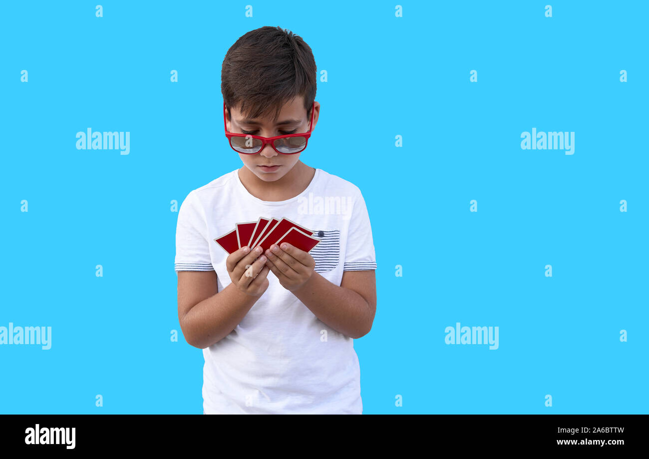 Child hand holding playing cards hi-res stock photography and images ...