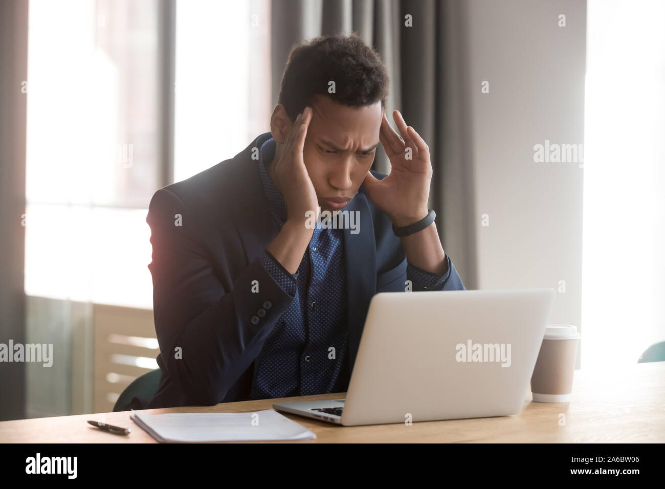 Stressed depressed african american manager feels headache at office ...