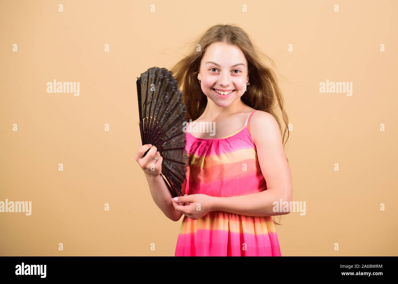 Air conditioner. Waving to create current air. Little girl waving ...