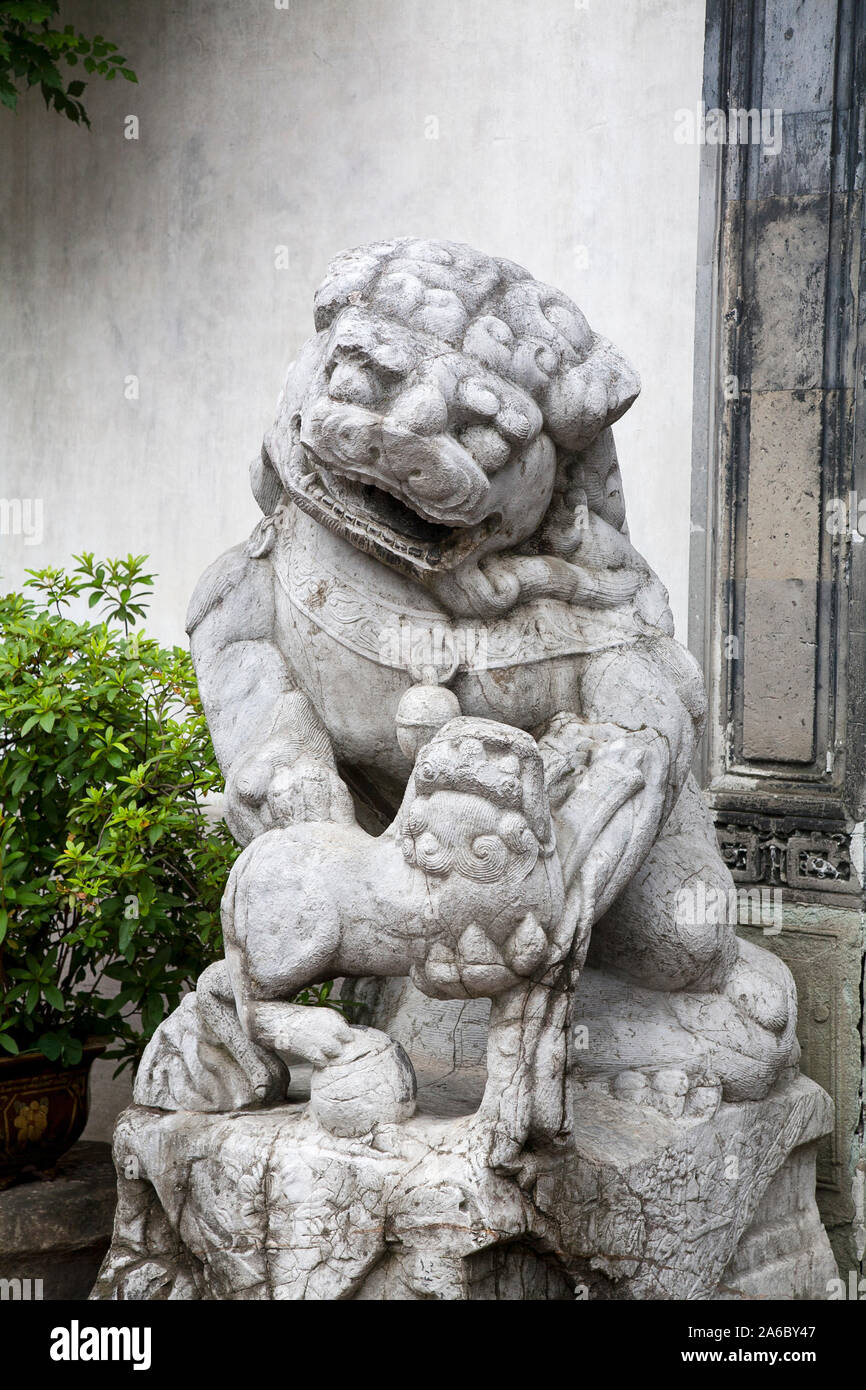 Ornate carved Chinese guardian lion in Yuyuan or Yu Garden of Happiness ...