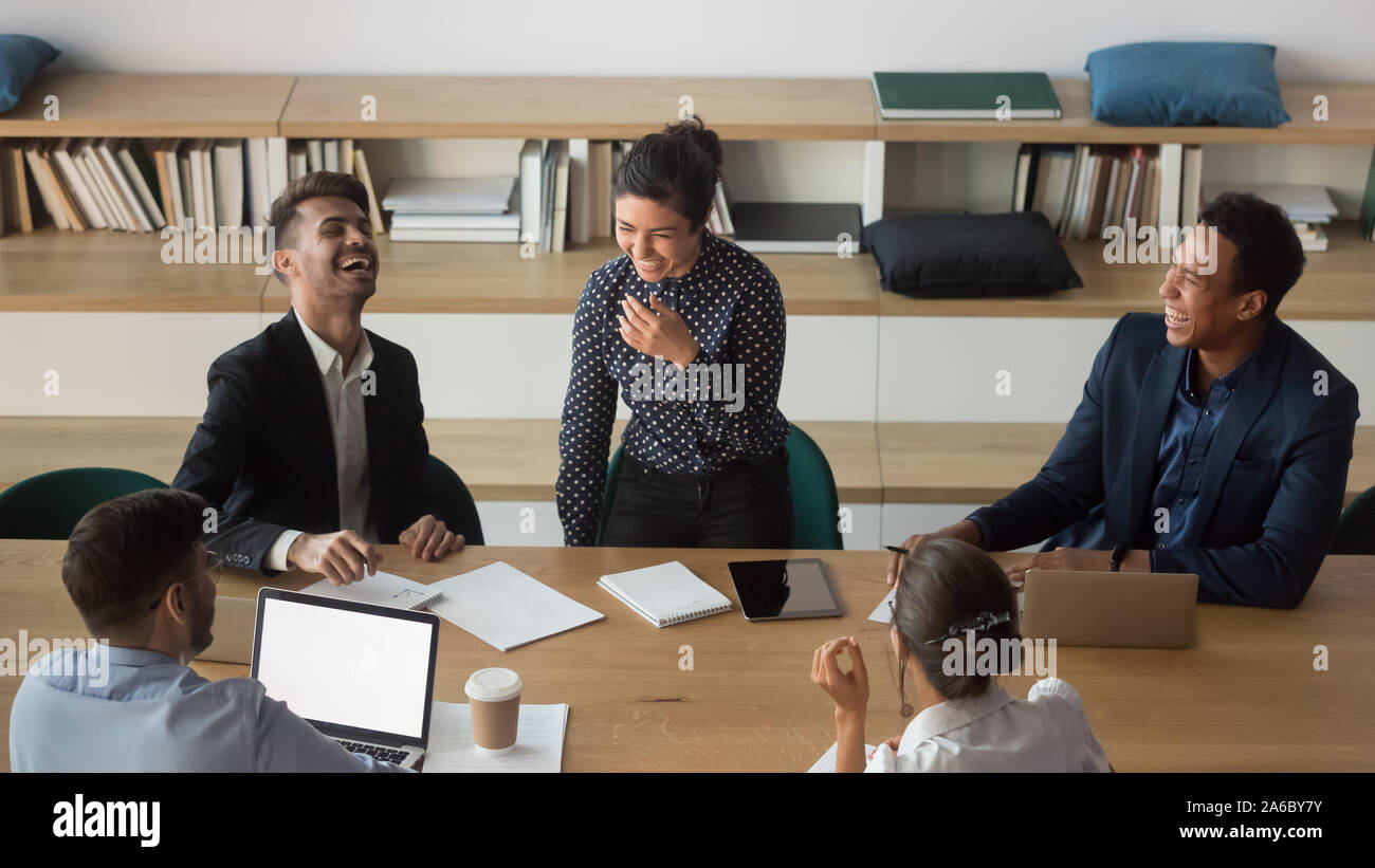 Millennial diverse team having fun at meeting in office Stock Photo - Alamy
