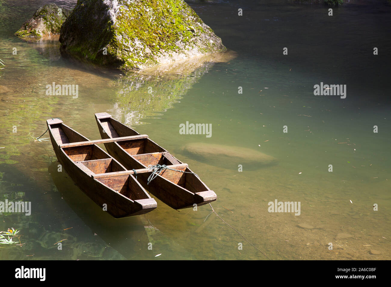 Two small traditional Chinese fishing boats tied together at at Tribe ...