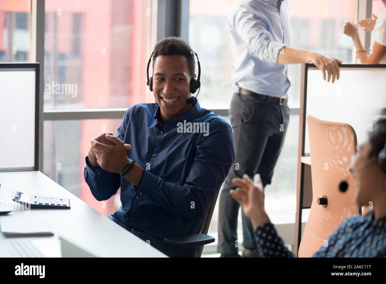 Smiling millennial black call center worker enjoying break time Stock ...