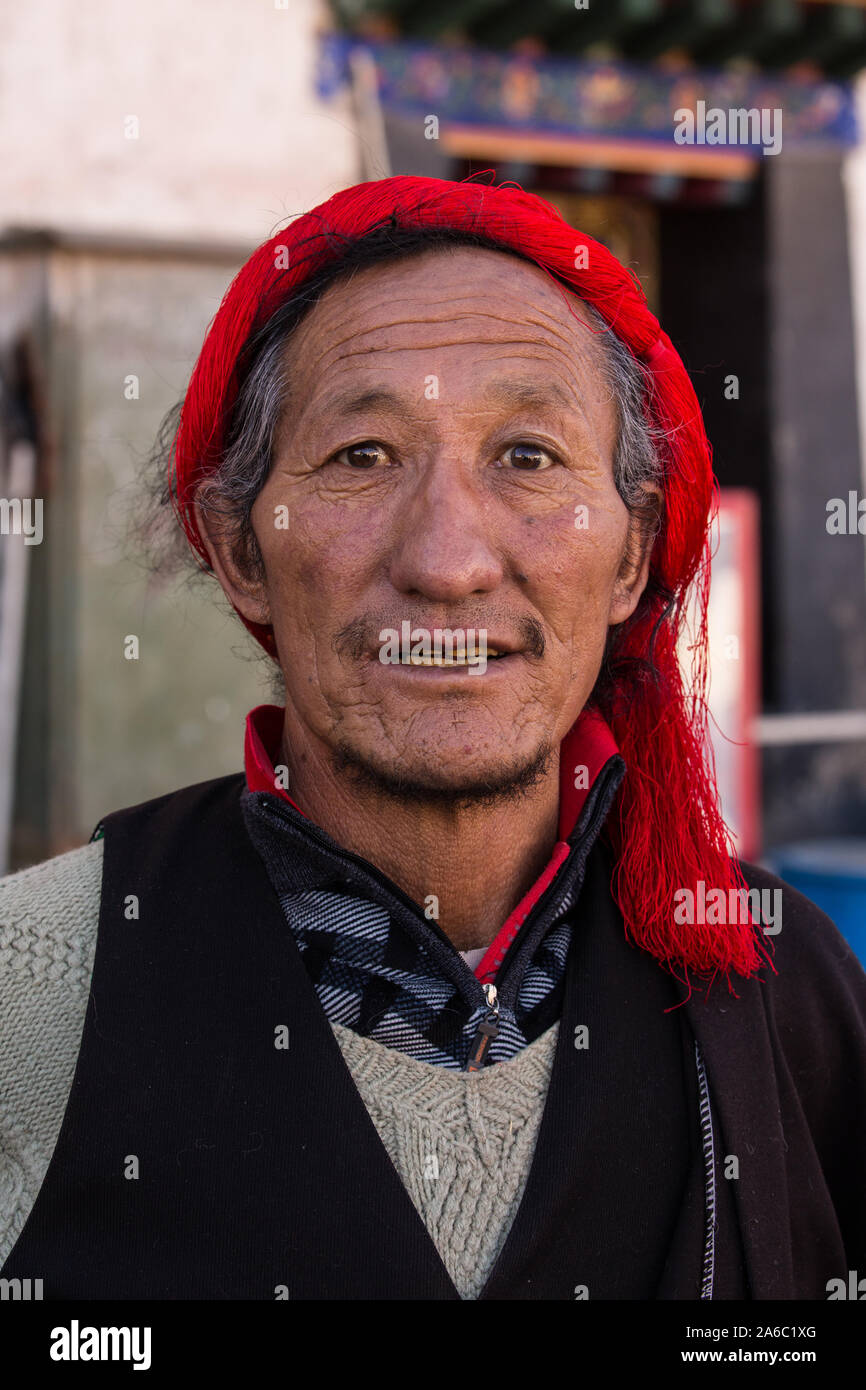 A Buddhist pilgrim from the Kham region of eastern Tibet with a ...