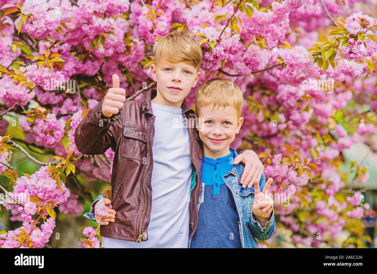 Happy spring holidays. Children enjoy warm spring. Boys posing near ...