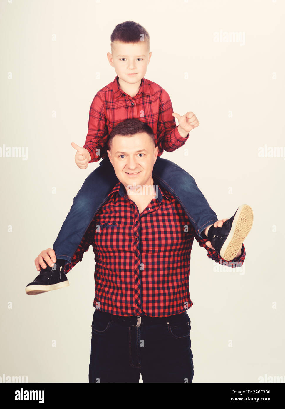 Father example of noble human. Father little son red shirts family look ...