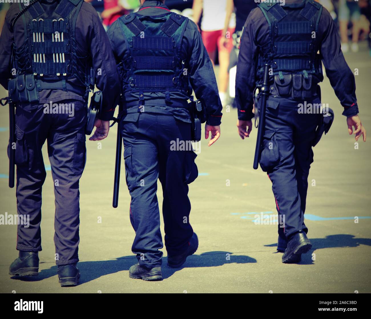 three policeman on the city with old toned effect Stock Photo - Alamy