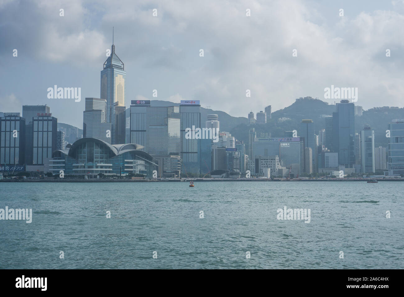 Walking on the promenade of the Hong Kong on Kowloon harbor , from this ...