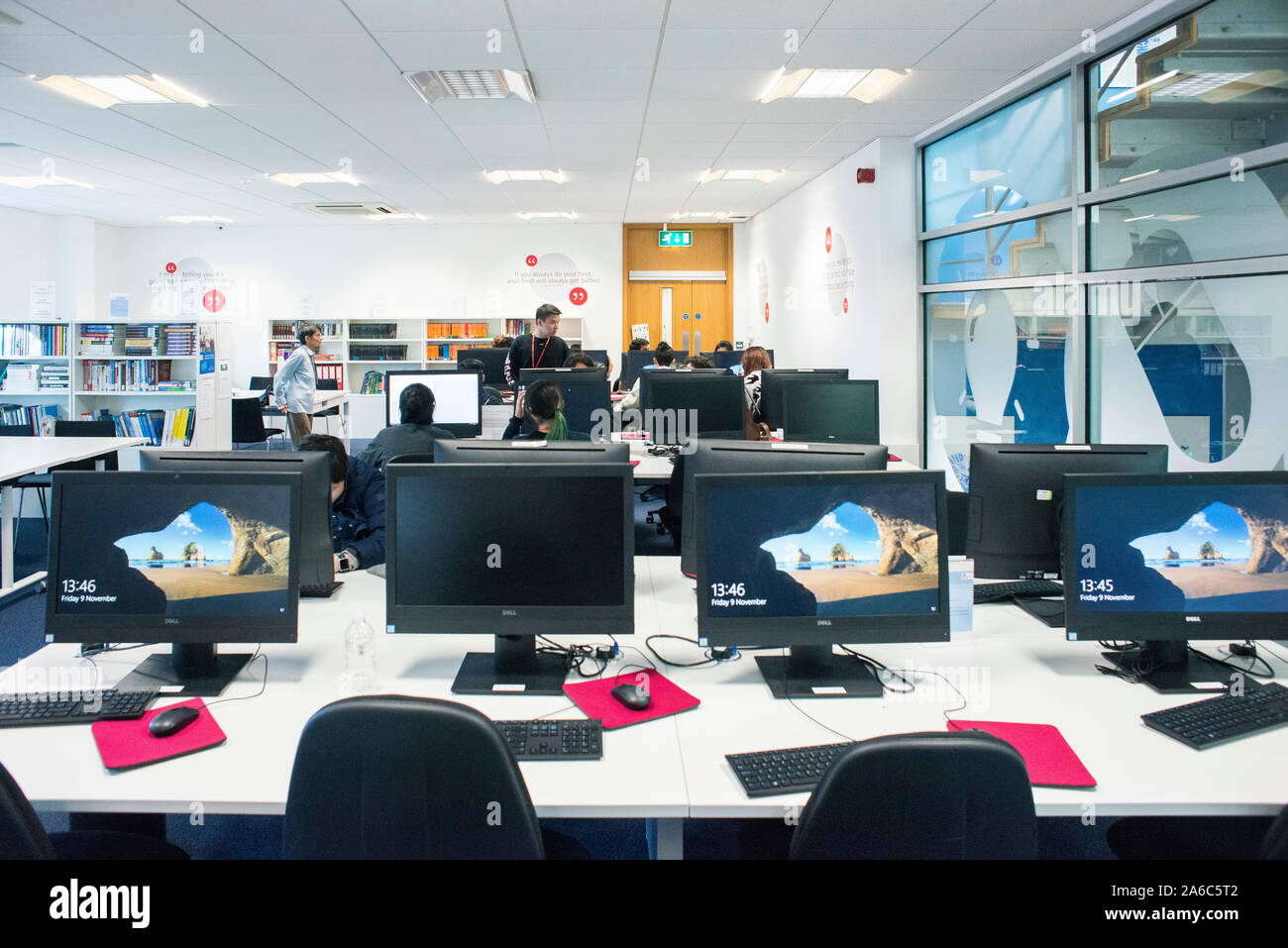 International students reading and working in the college library Stock ...