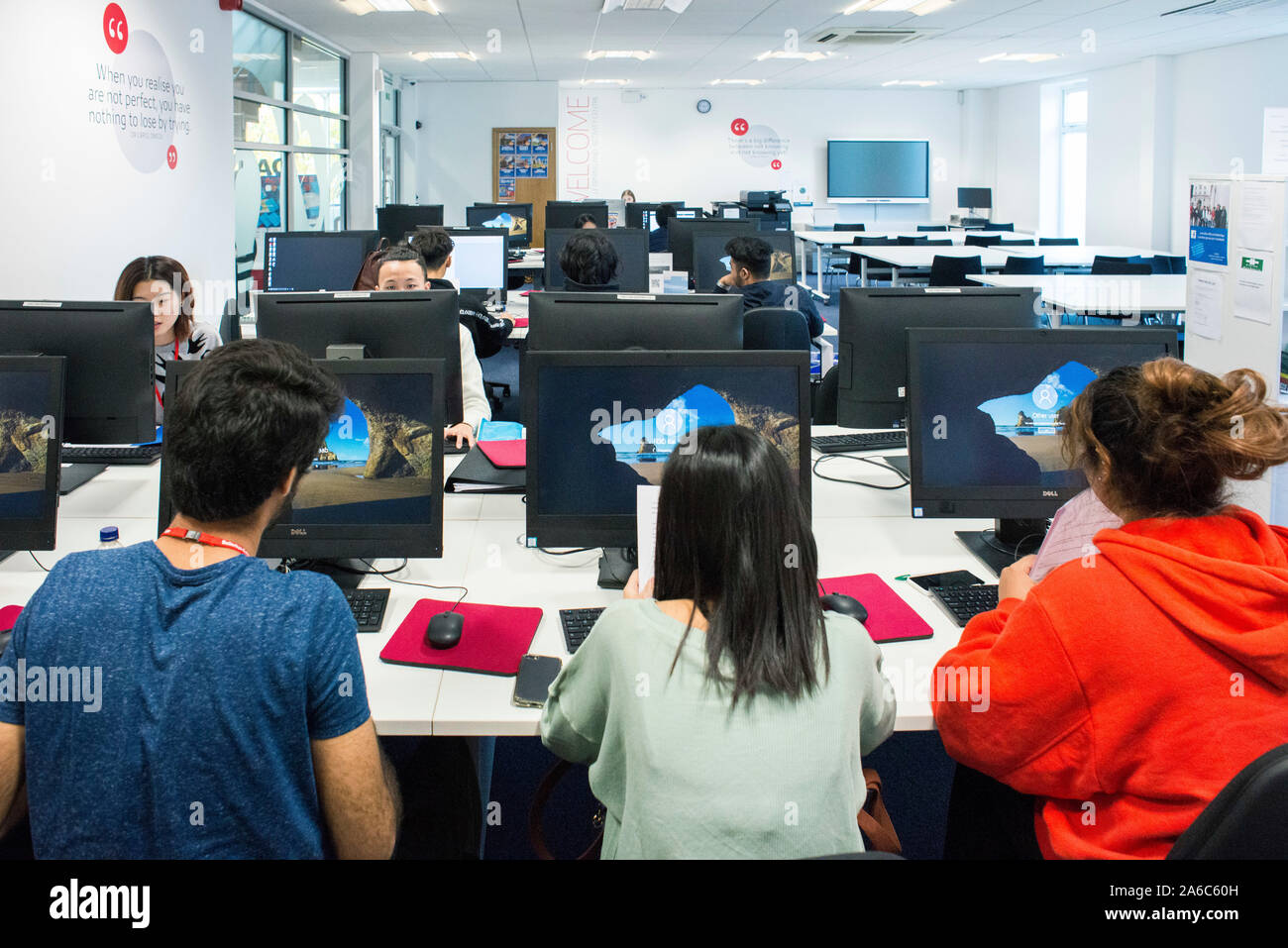 International students reading and working in the college library Stock ...