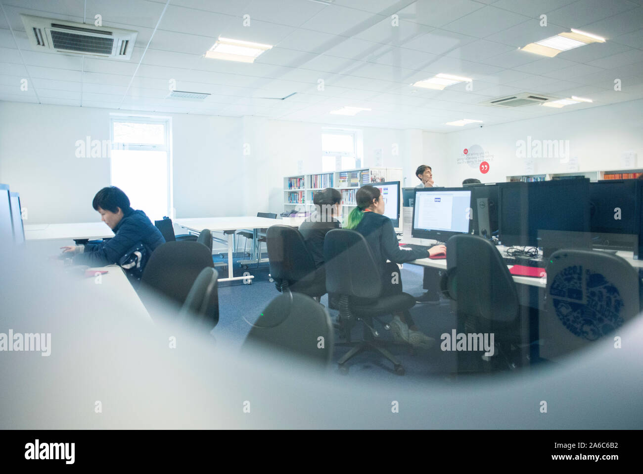 International students reading and working in the college library Stock ...