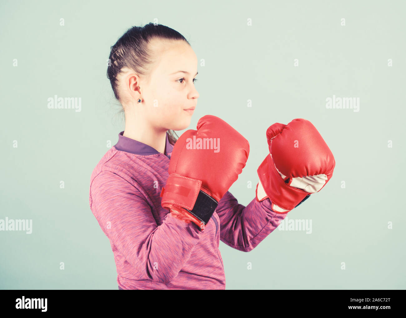 Girl cute boxer on blue background. Contrary to stereotype. Boxer child ...