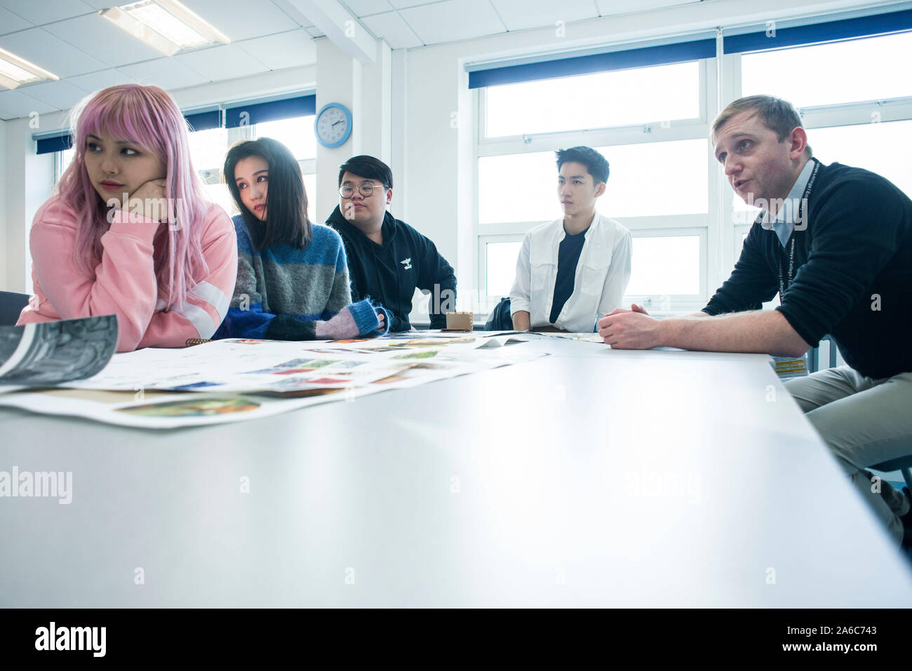 International students in art class study at a table Stock Photo - Alamy