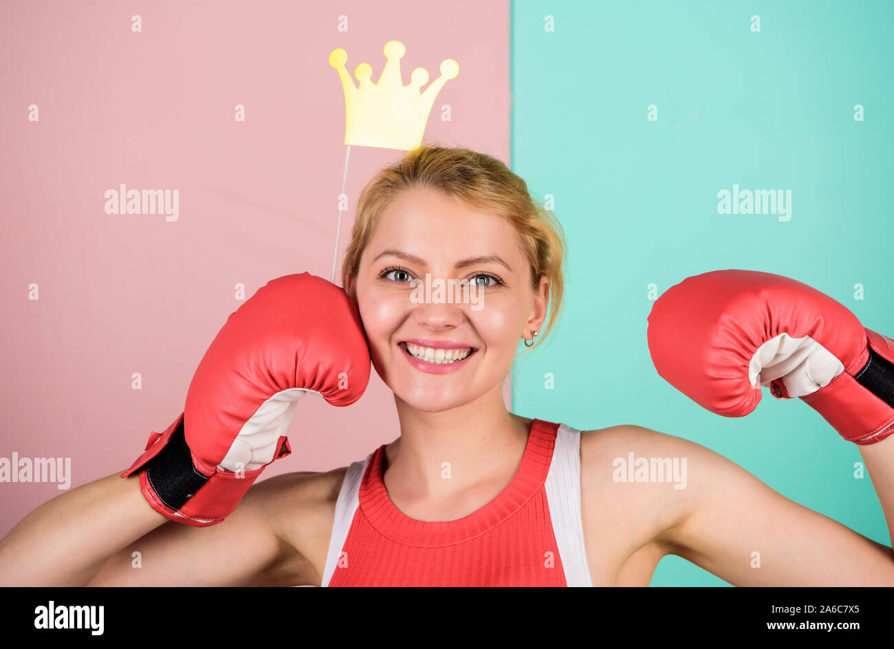 Queen of boxing ring. Sportswoman with princess crown. Cheerful girl ...