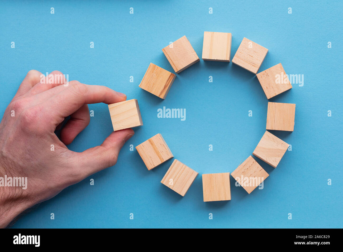Hand choosing a wooden block from a set. Business choice concept Stock ...