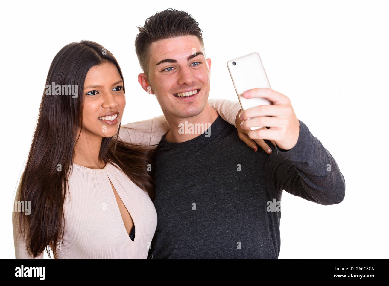 Happy Young Couple Smiling While Man Taking Selfie Together With Stock