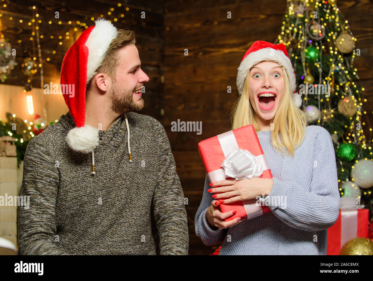 Holiday that is celebrated around world. Loving couple christmas tree ...