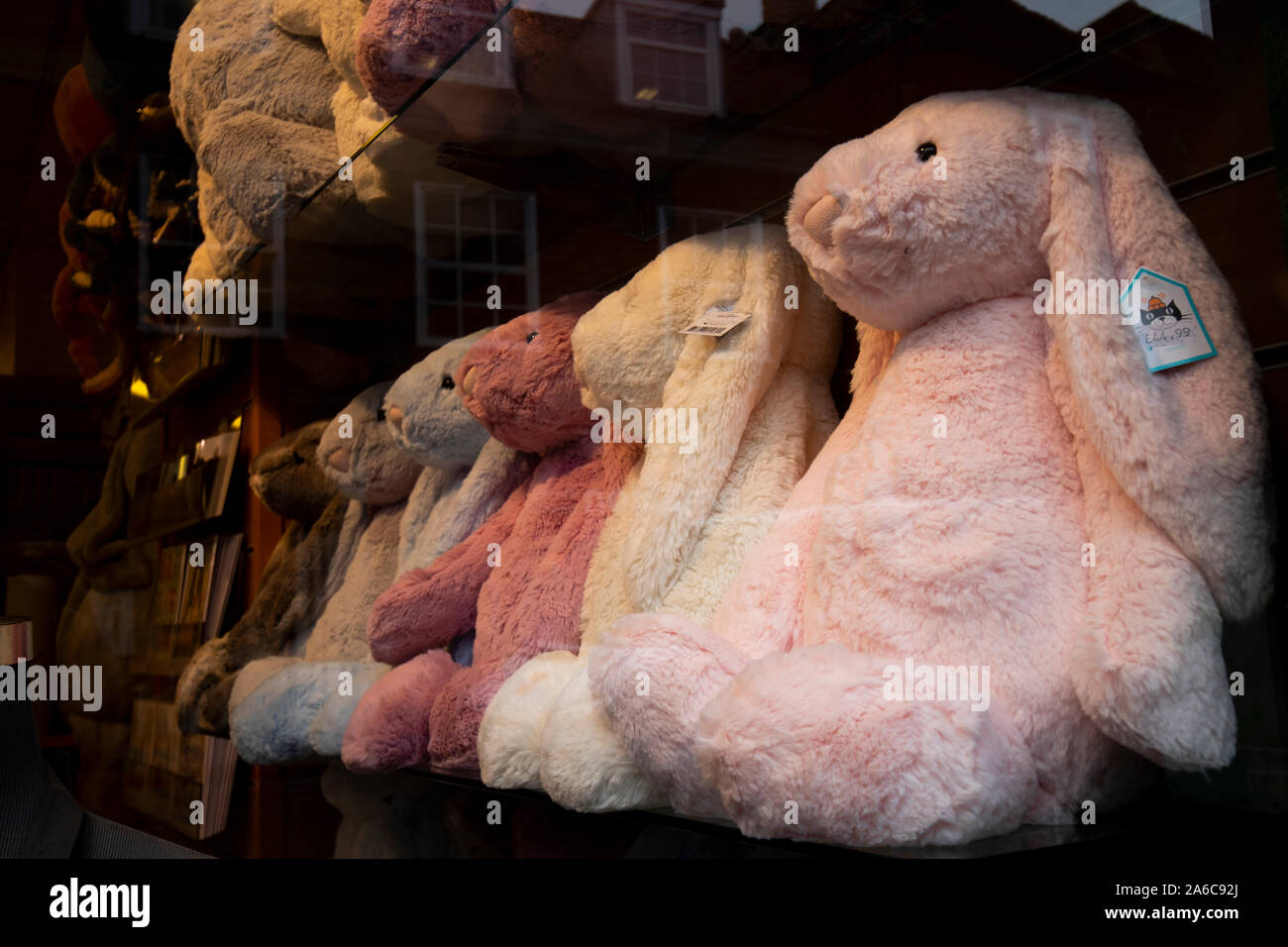 toy rabbits in shop window display Stock Photo - Alamy