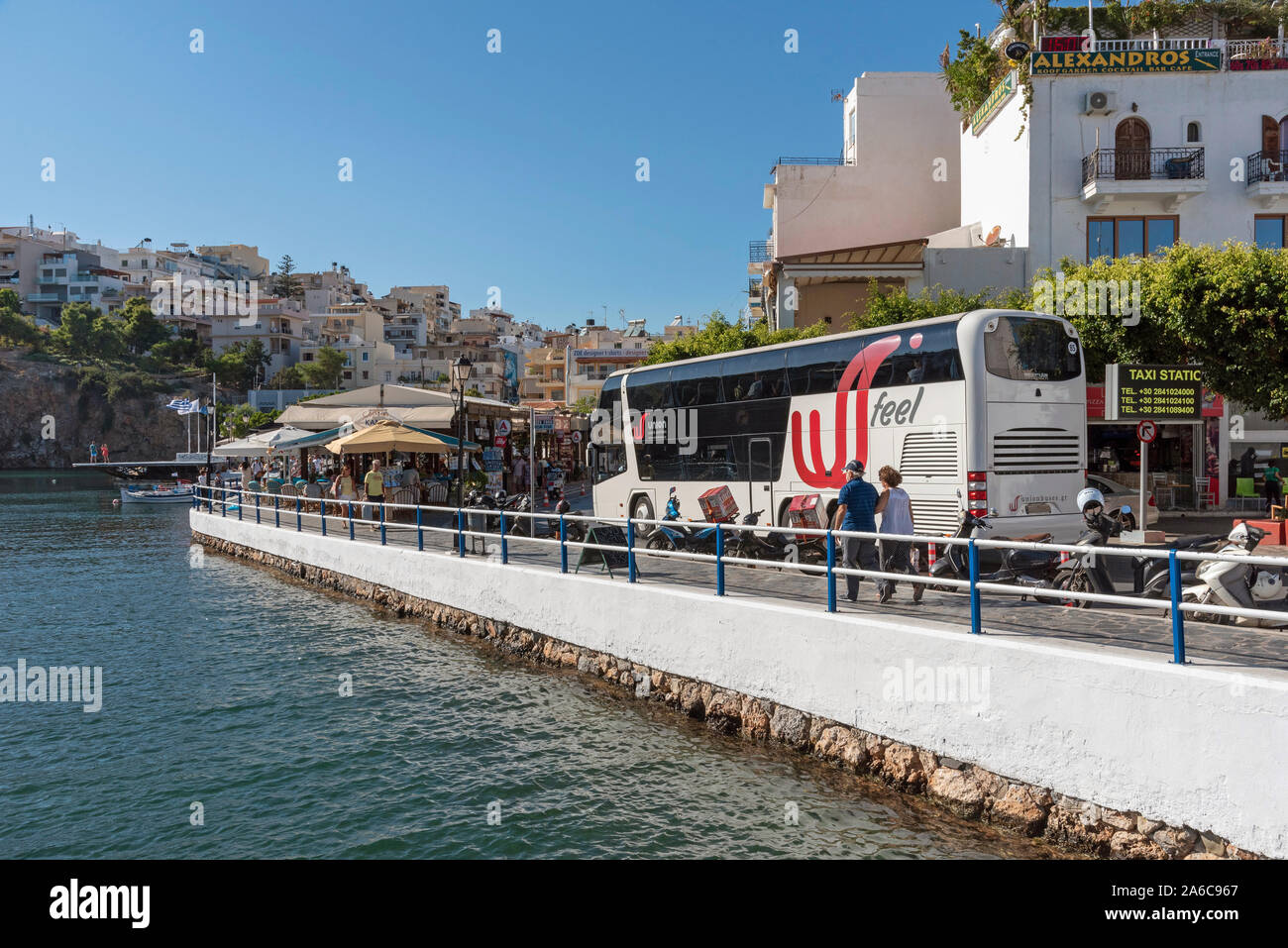 Agios Nikolaos, eastern Crete, Greece. October 2019. A tour bus on The ...