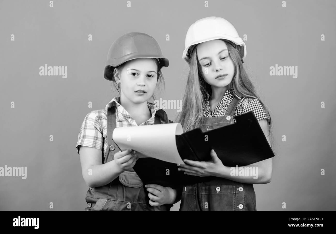 Little kids in helmet with tablet. school project. Happy children ...