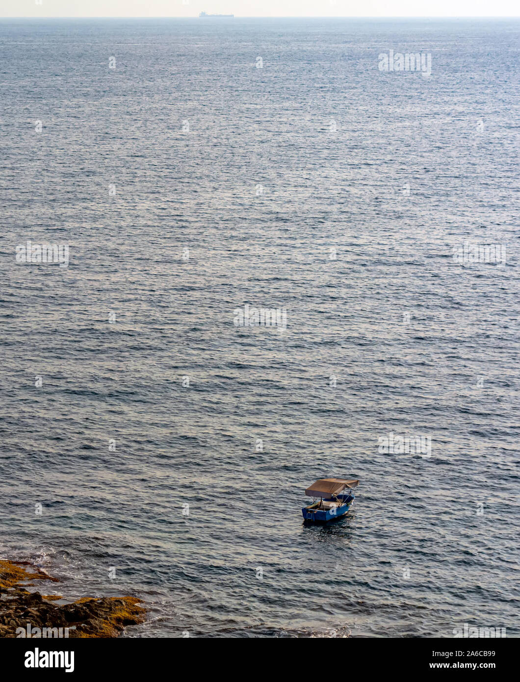 Lonely boat fishing hi-res stock photography and images - Alamy
