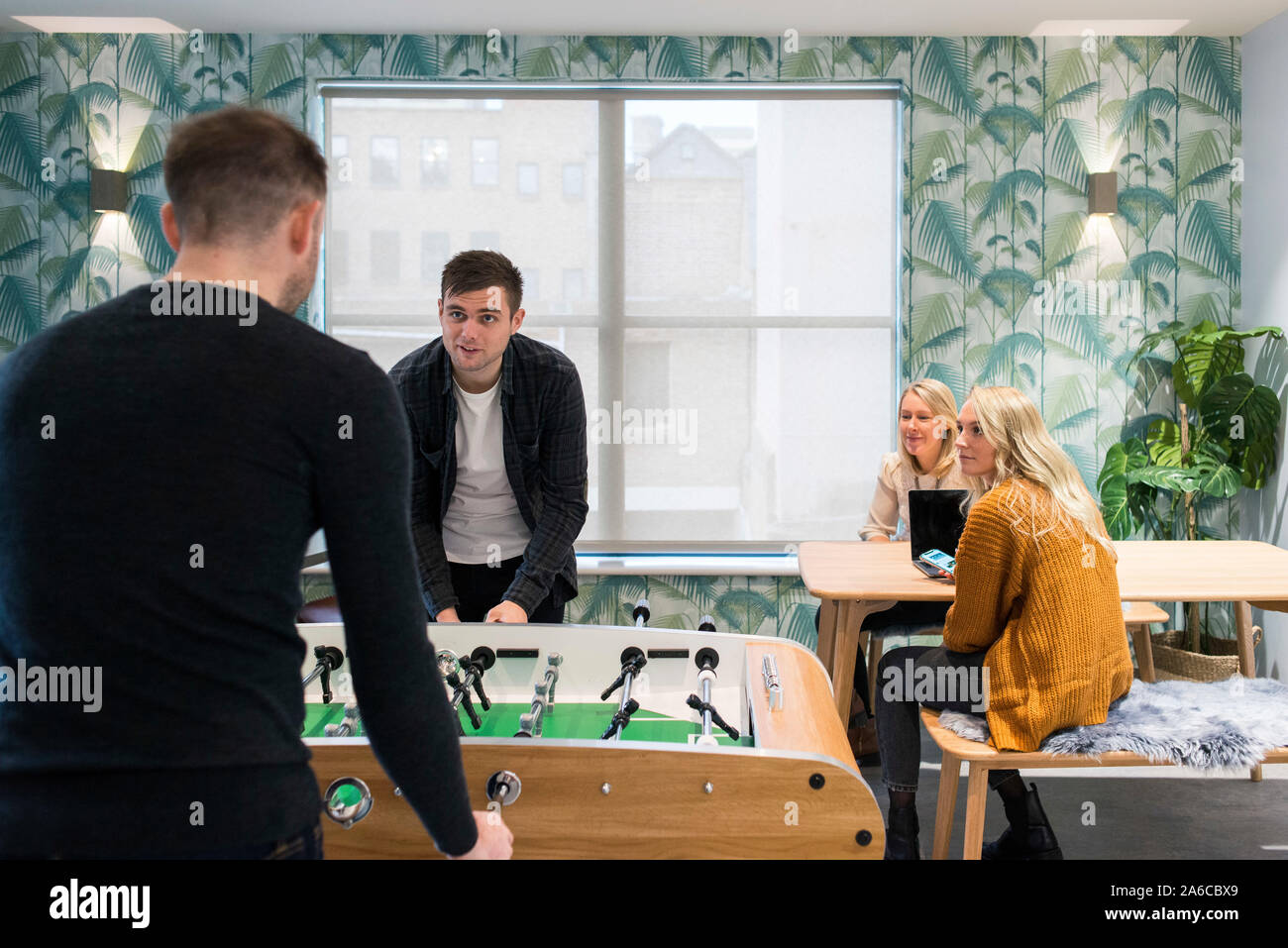 Playing table football in office hi-res stock photography and images ...