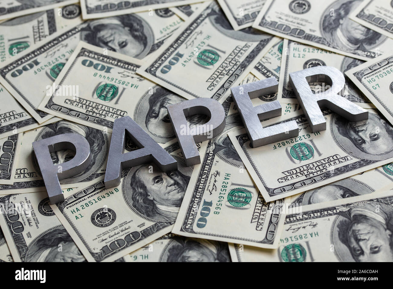 The word PAPER laid with aluminium letters on the US dollar banknotes ...