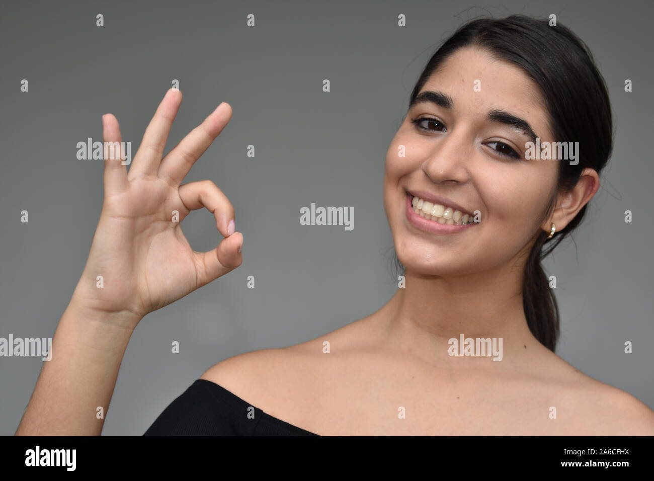 Beautiful Female And Okay Sign Stock Photo - Alamy