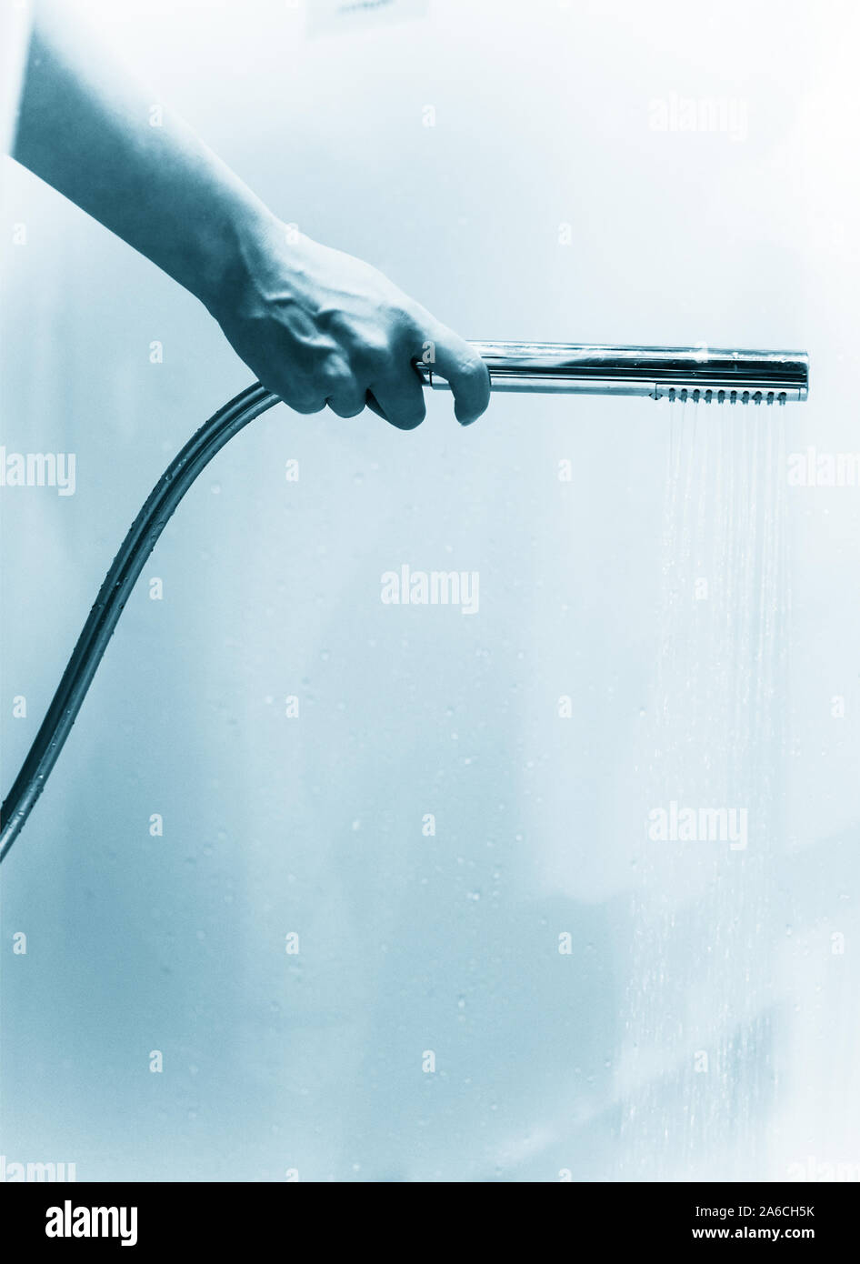 hand holds the shower head Stock Photo - Alamy