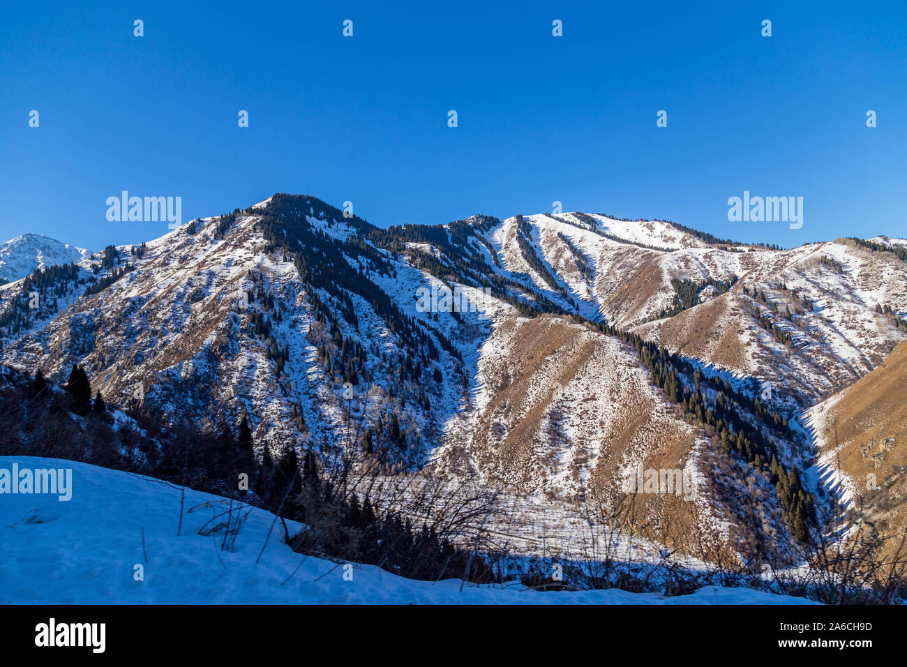 Winter Snowy Mountains valley with sun in Ak Bulak, Almaty, Kazakhstan ...