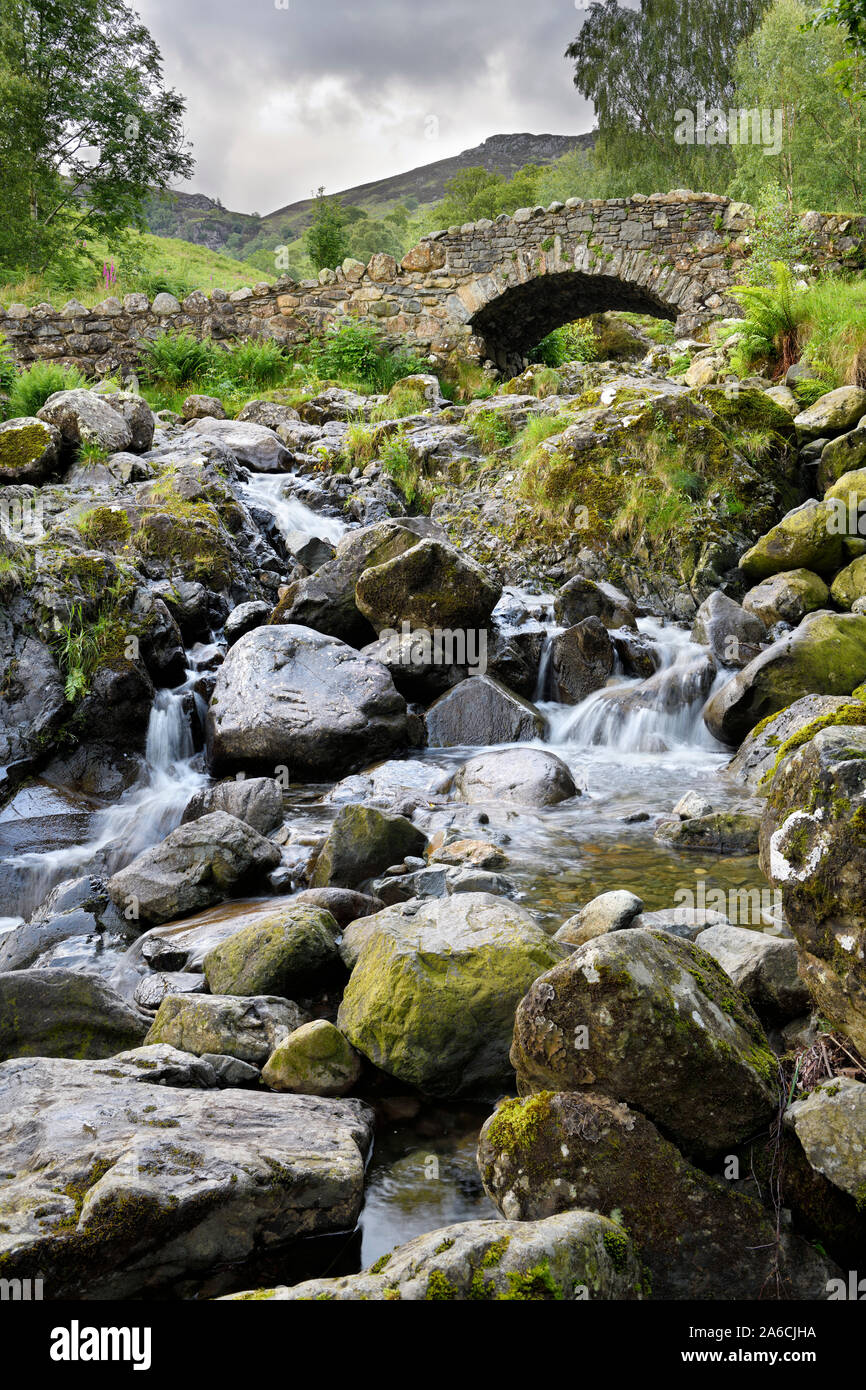Waterfalls on the Barrow Beck river at historic stone packhorse bridge ...