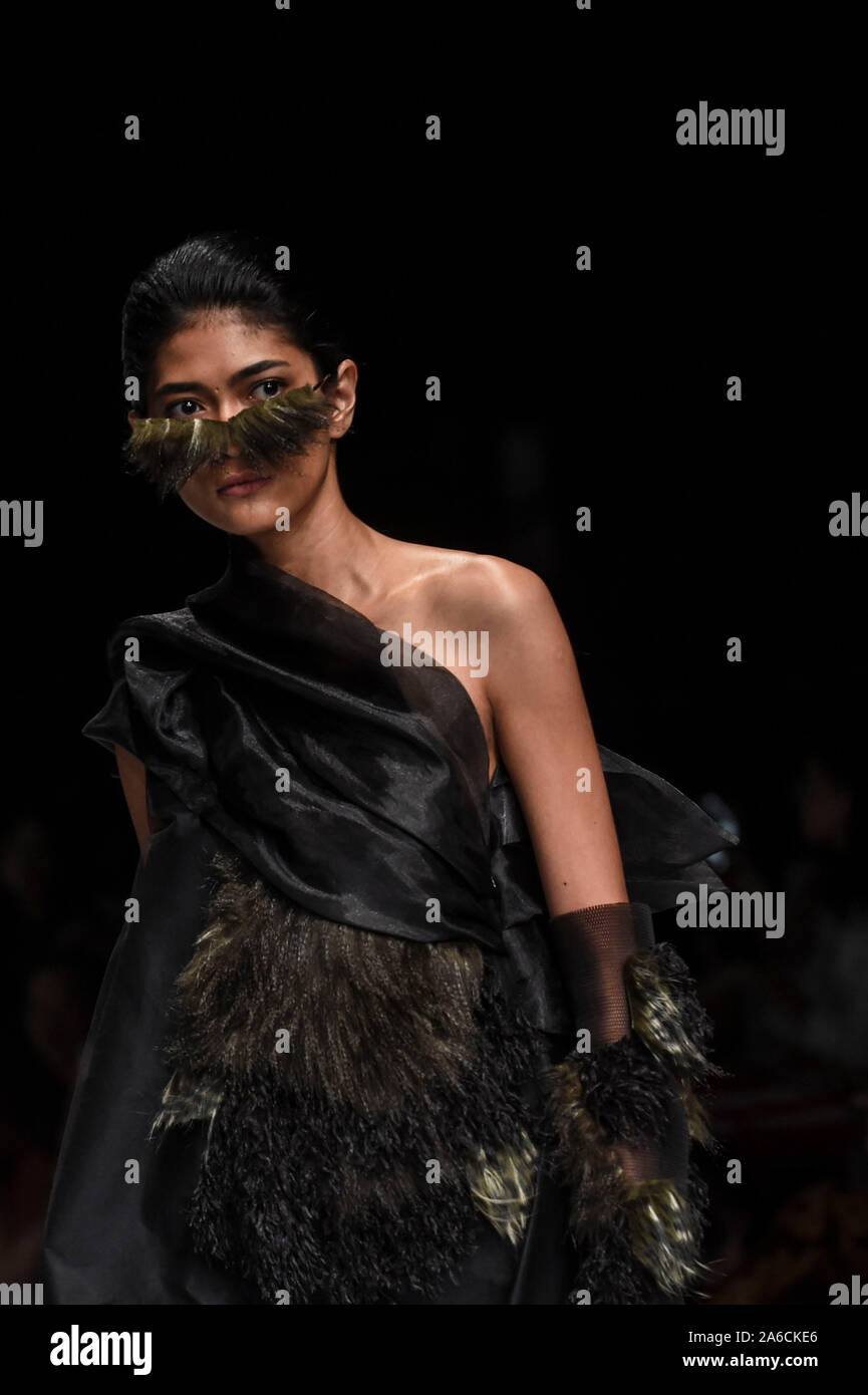 Jakarta, Indonesia. 25th Oct, 2019. A model presents a creation of ...