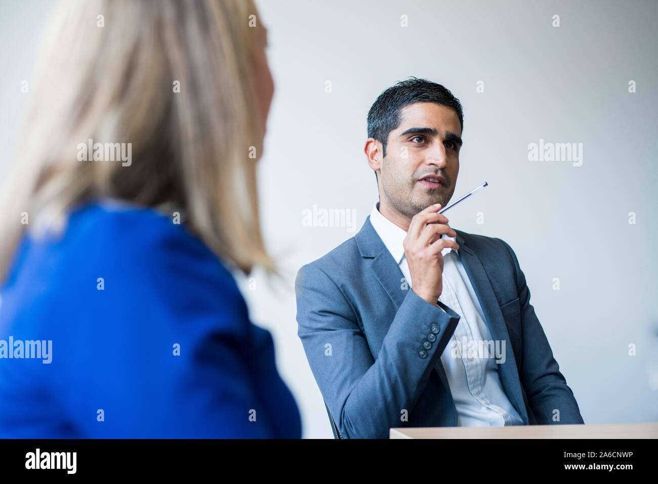 Group people sitting round table hi-res stock photography and images ...