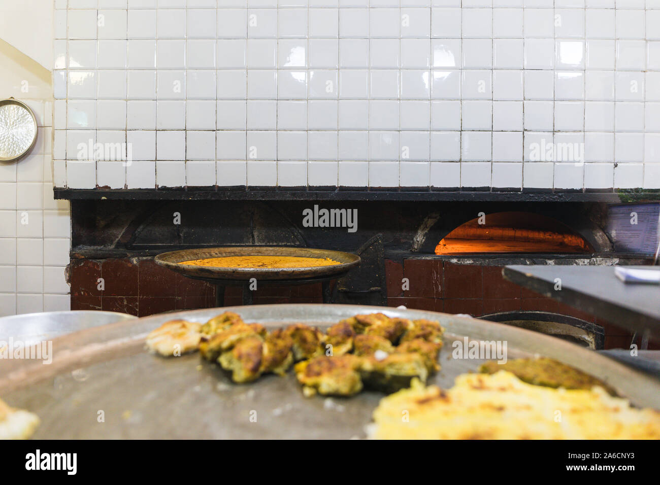 Hot Ligurian farinata in front of traditional oven in Genova Italy ...