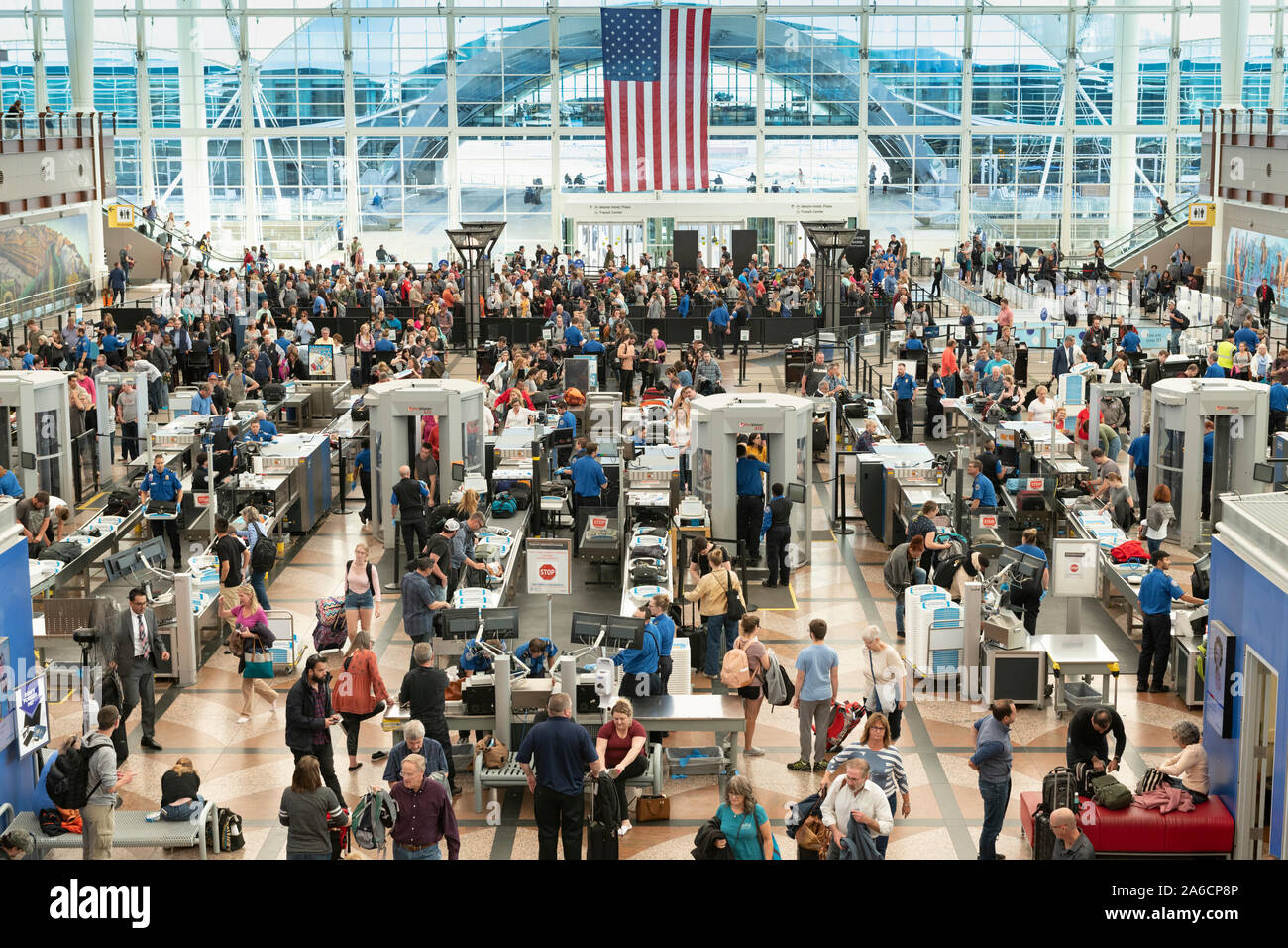 Crowd of travelers await TSA screening at Denver International Airport ...