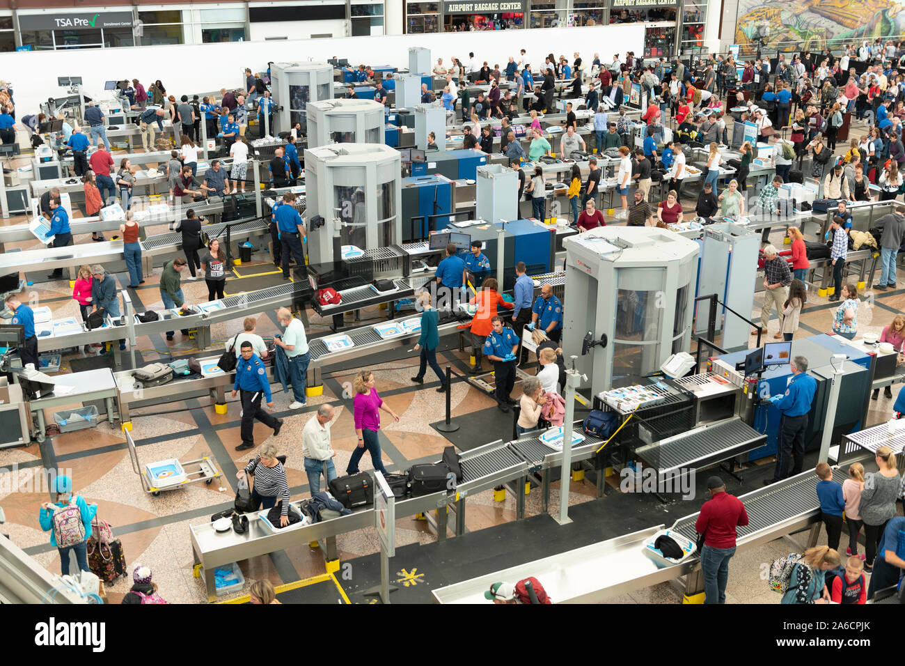 Crowd of travelers await TSA screening at Denver International Airport ...