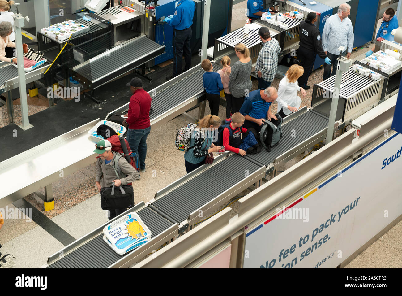 Crowd of travelers await TSA screening at Denver International Airport ...