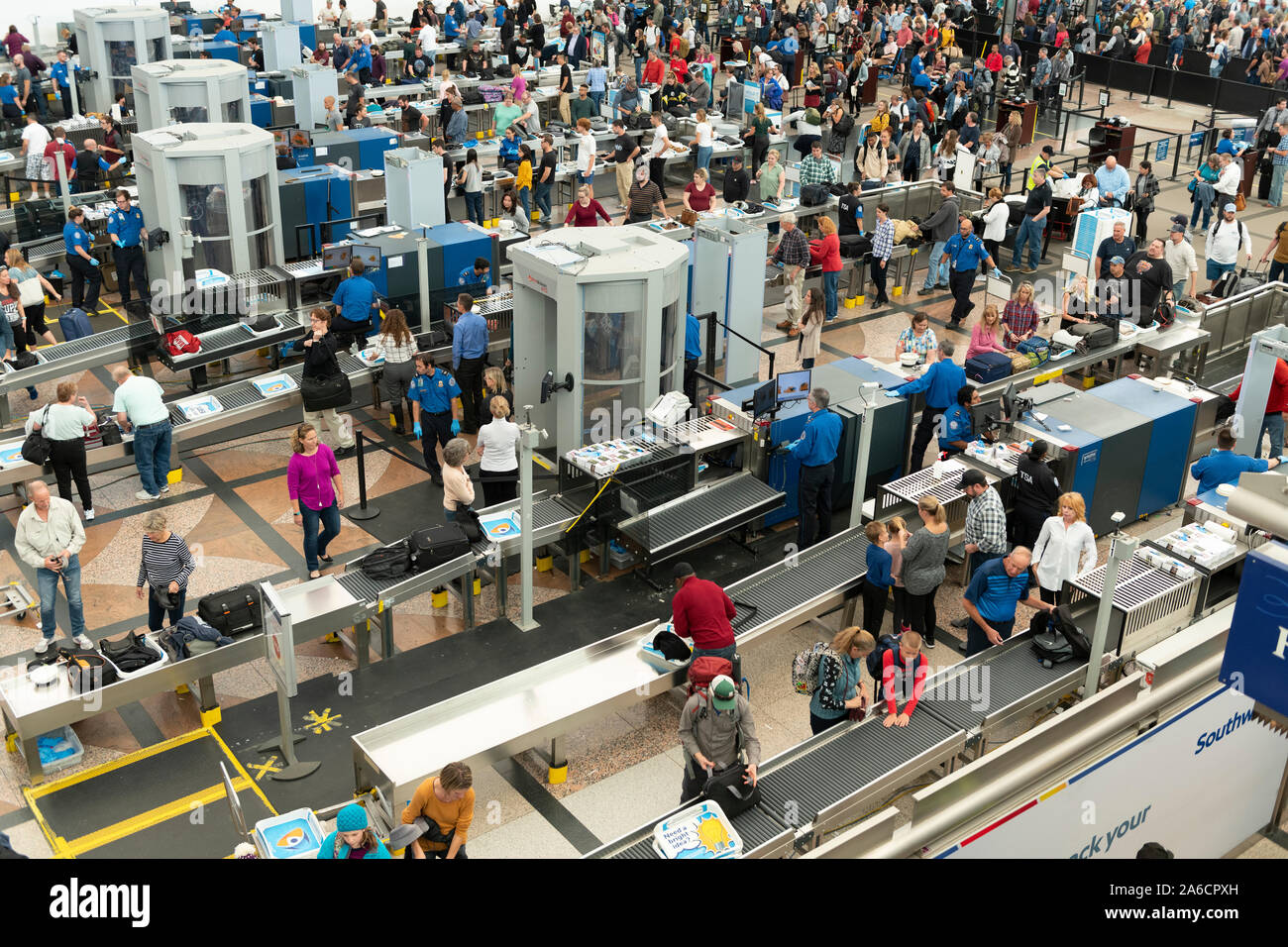 Crowd of travelers await TSA screening at Denver International Airport ...