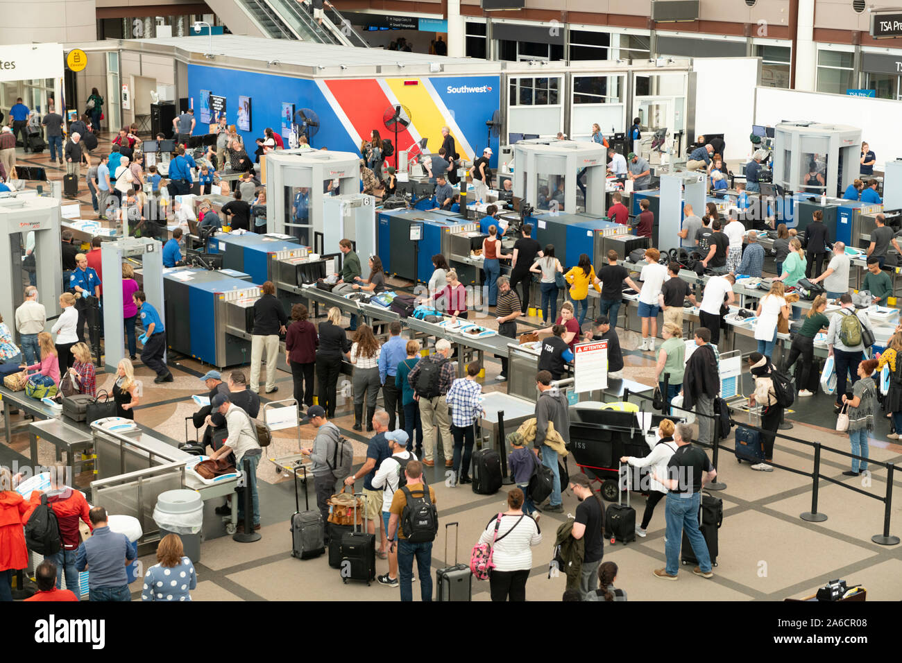 Crowd of travelers await TSA screening at Denver International Airport ...