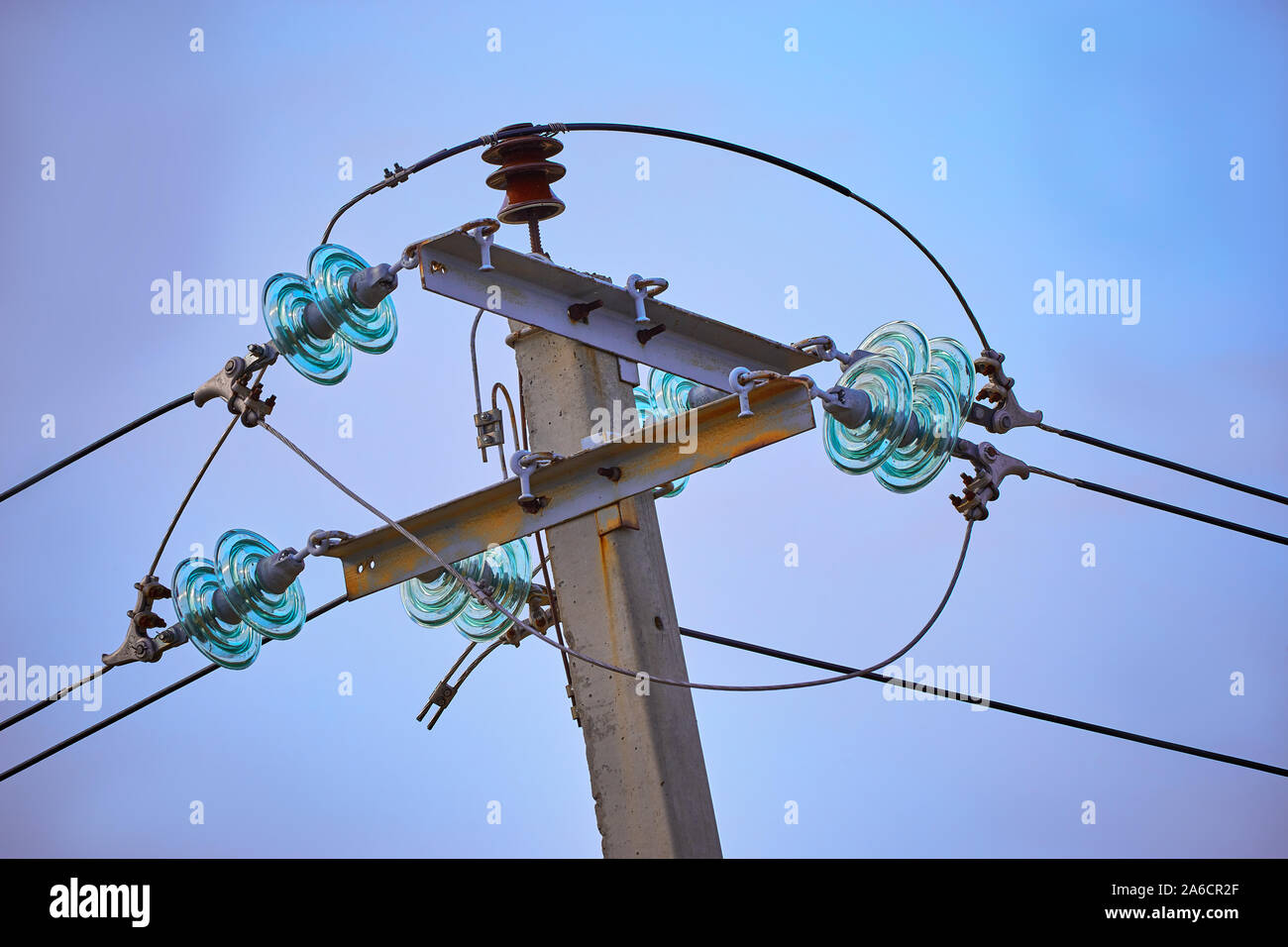 The top of electric pole on blue sky background Stock Photo - Alamy