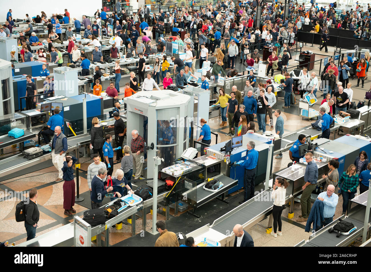 Crowd of travelers await TSA screening at Denver International Airport ...