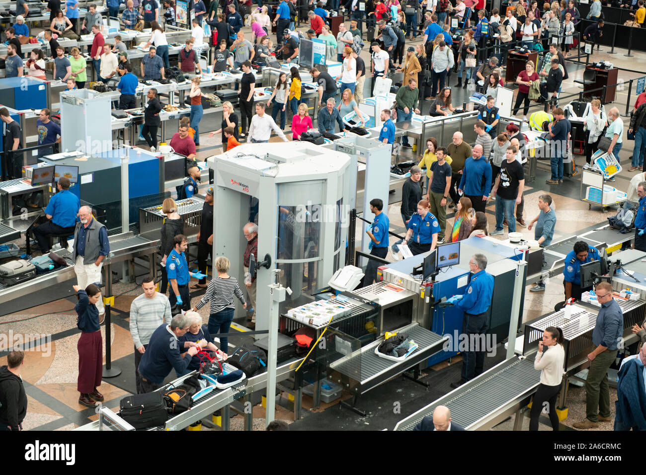 Crowd of travelers await TSA screening at Denver International Airport ...