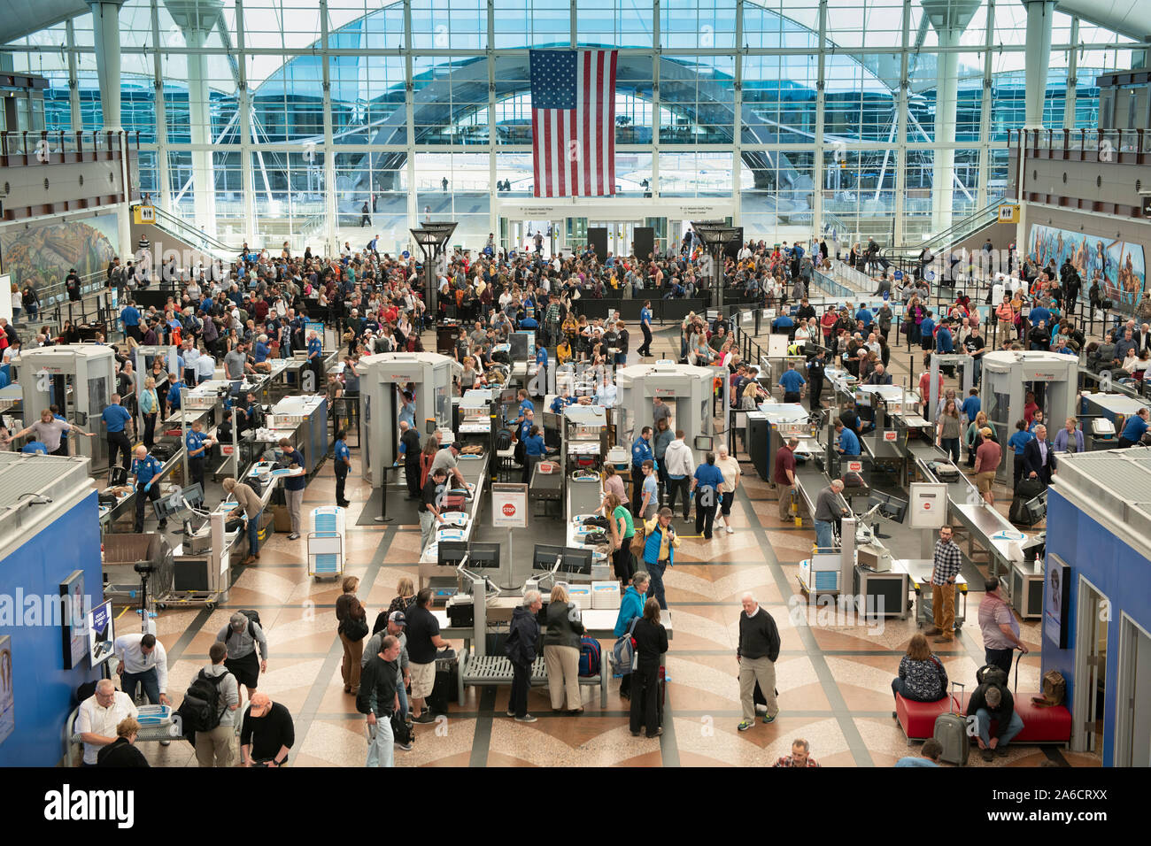 Crowd of travelers await TSA screening at Denver International Airport ...