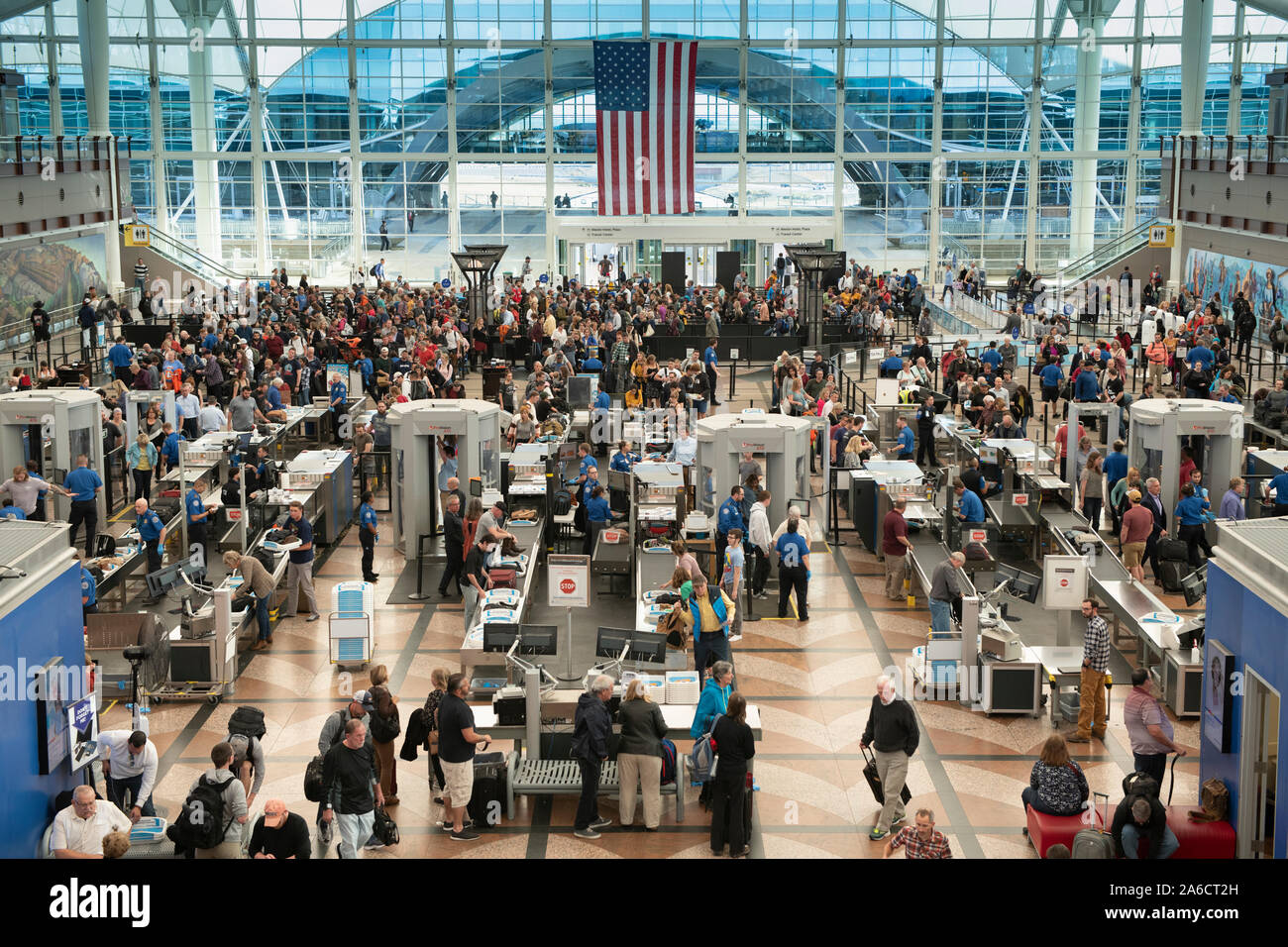 Crowd of travelers await TSA screening at Denver International Airport ...