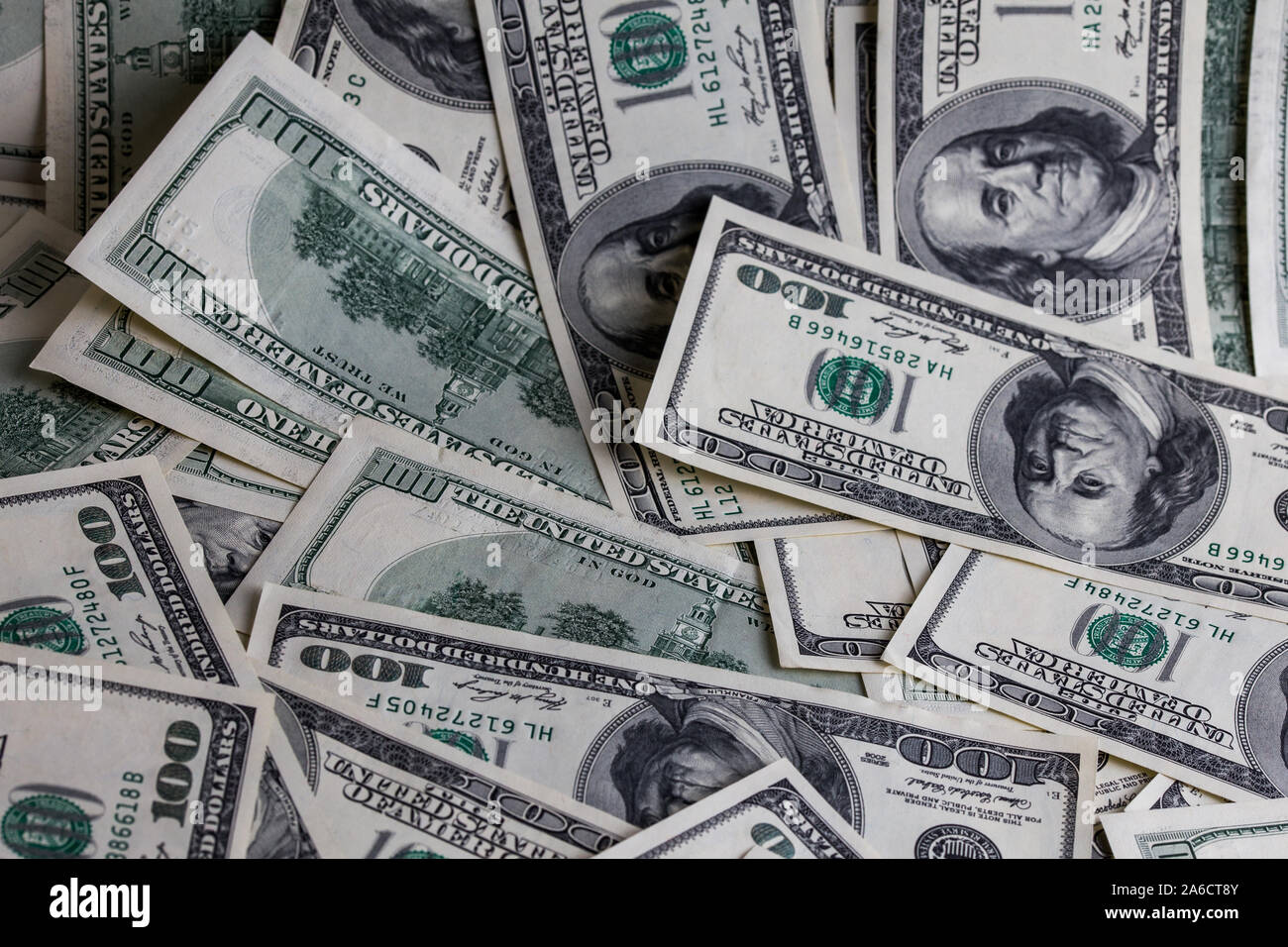 one hundred us dollar banknotes random pattern background Stock Photo ...