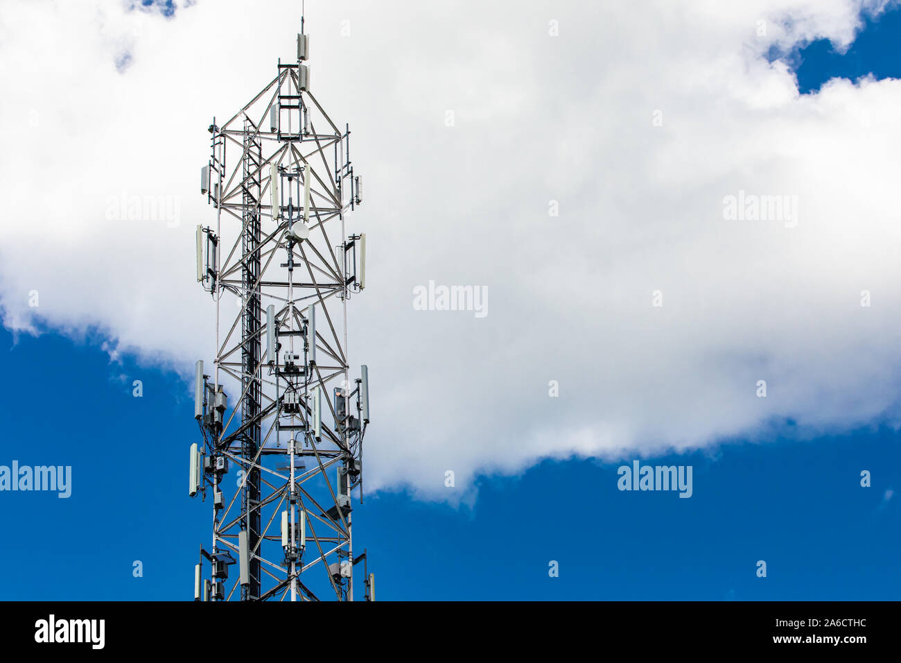 A closeup view on the top part of a mobile communications cell tower ...