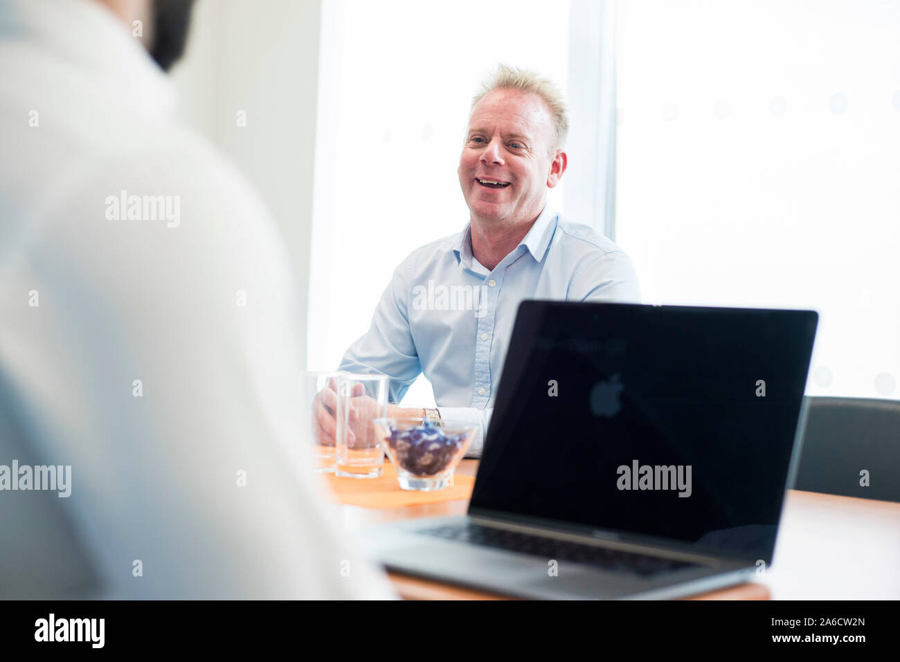 two people sat at a table having a meeting or a job interview Stock ...