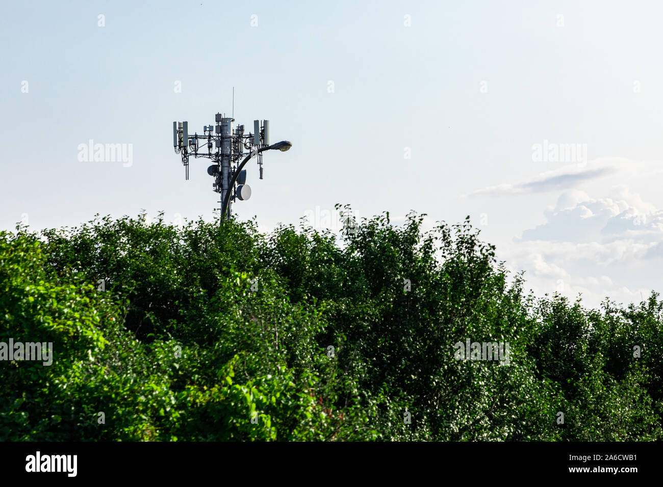 A closeup view on the top part of a mobile communications cell tower ...