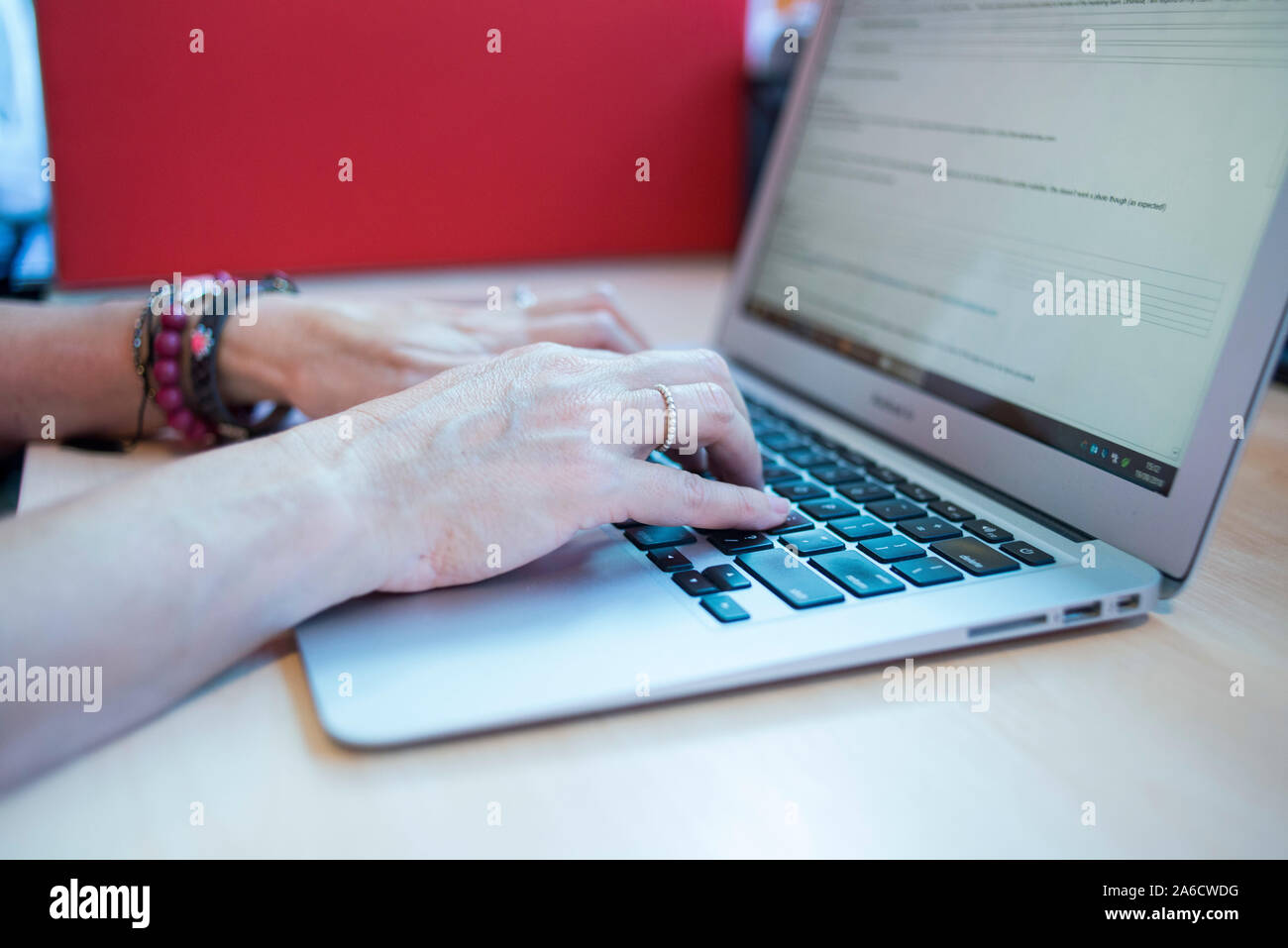 Female hands typing on a lap top keyboard Stock Photo - Alamy